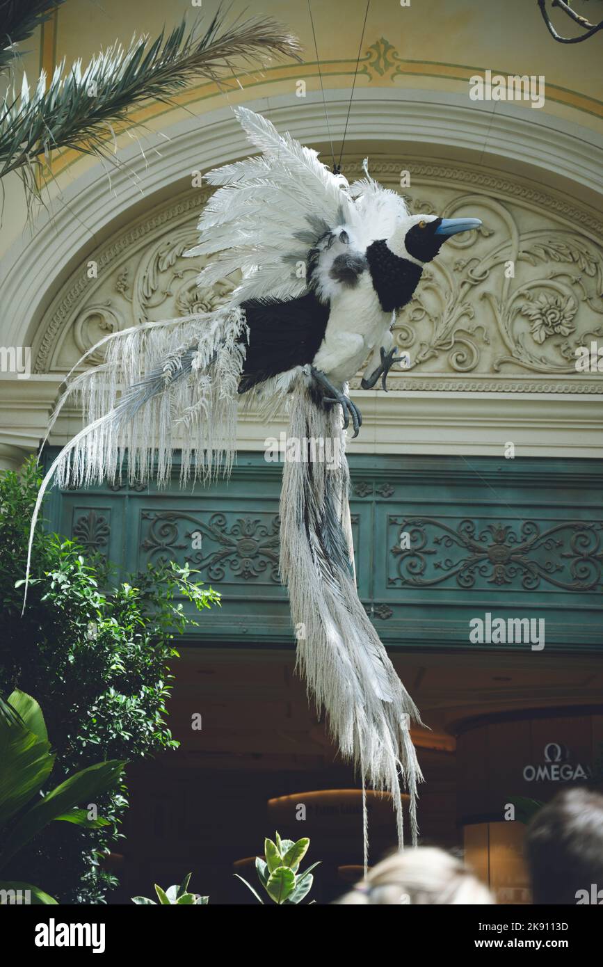 A vertical shot of the beautiful white bird statue in the Bellagio ...
