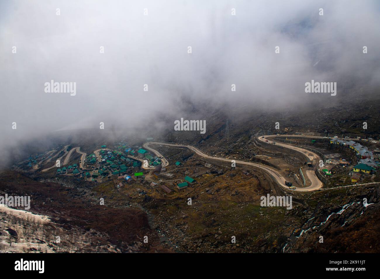 Beautiful view of mountain range under dense fog with base camps, near ...