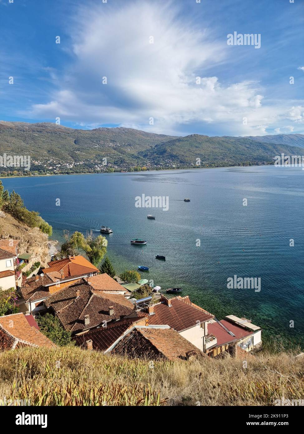 A view over lake Ohrid in the old town Ohrid with brown roofed houses ...