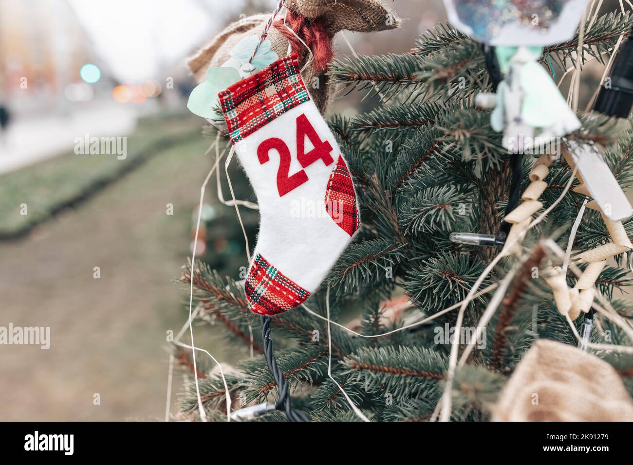 Handmade Christmas sock decoration with number or date 24 on a ...