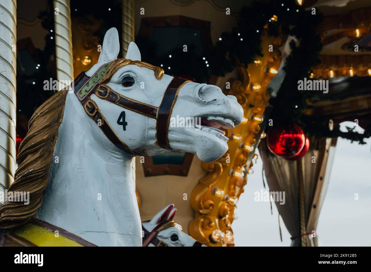 A closeup shot of a white carousel horse in an amusement park Stock ...