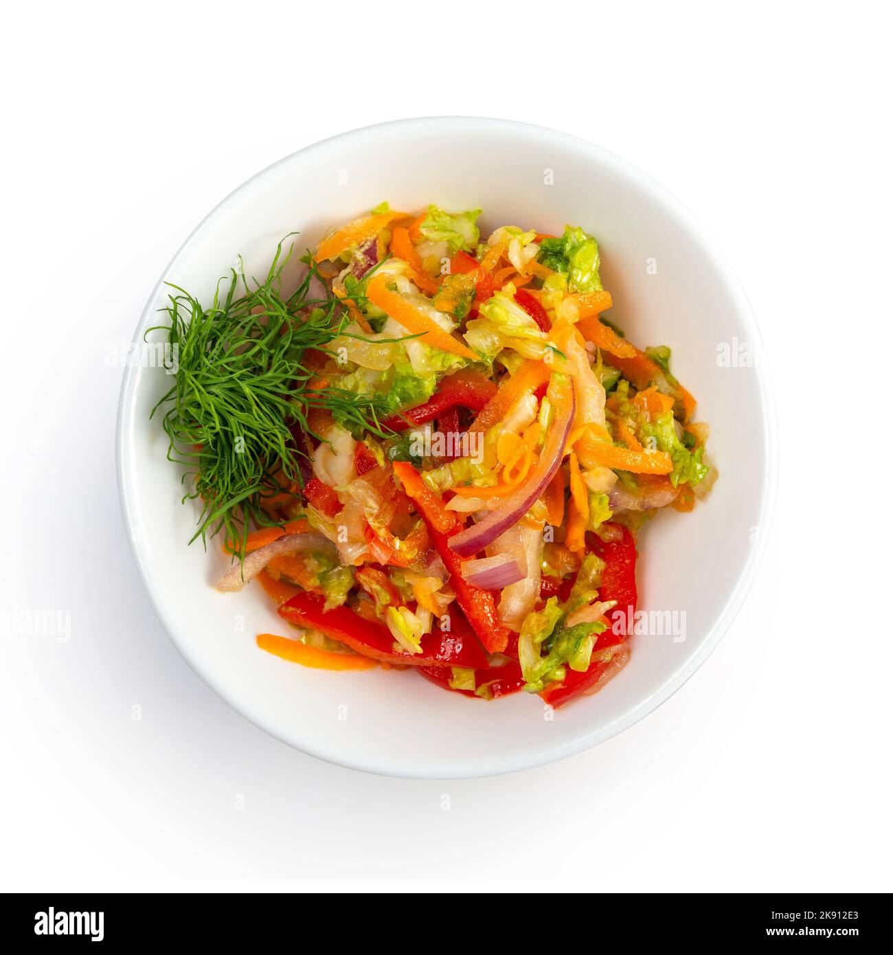 Portion of salad with fresh vegetables in glass bowl isolated on white ...
