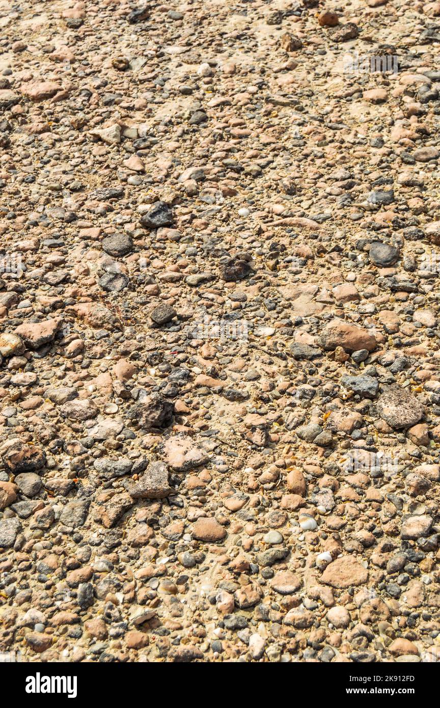 A vertical closeup of a pebbled ground Stock Photo - Alamy