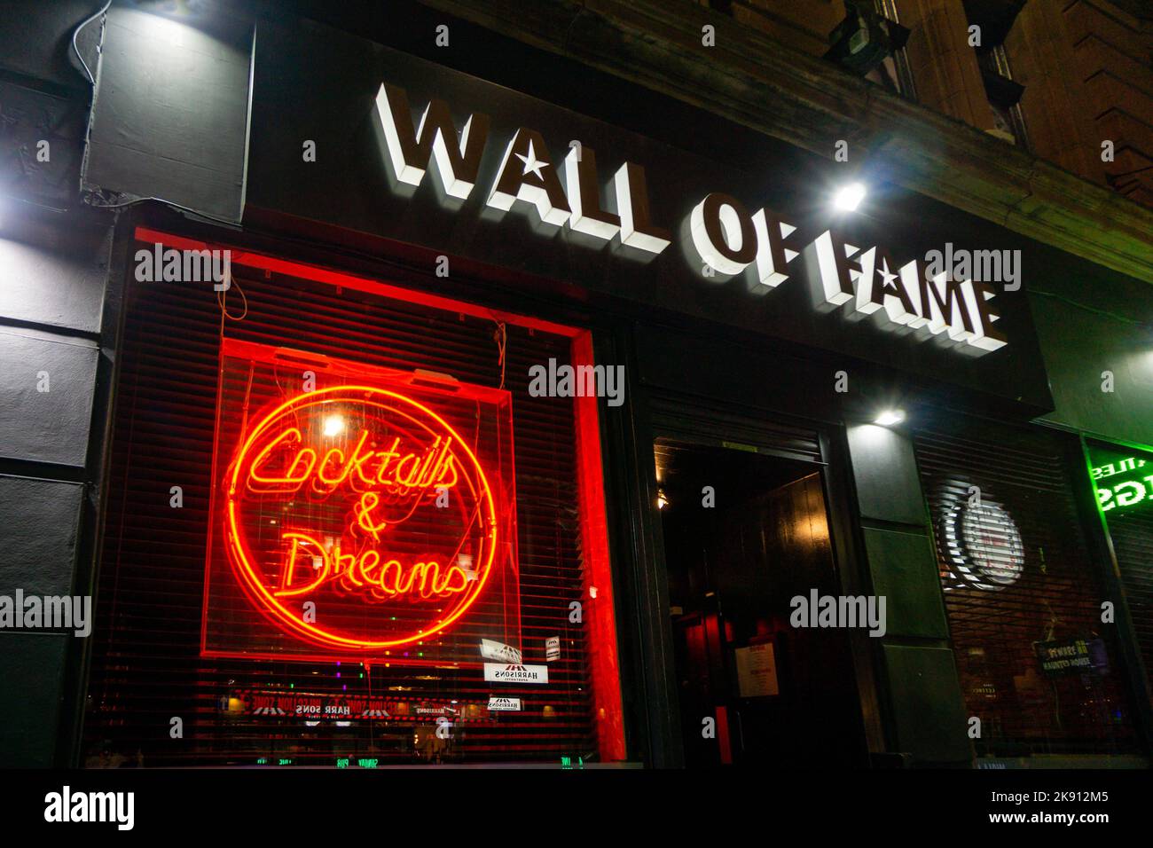 Liverpool Wall of Fame bar with lighted window sign saying Cocktails ...