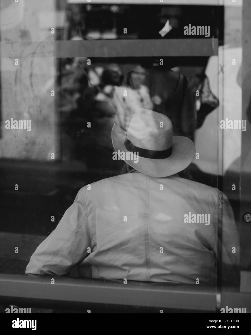 A back view of male wearing hat at the bus station Stock Photo - Alamy