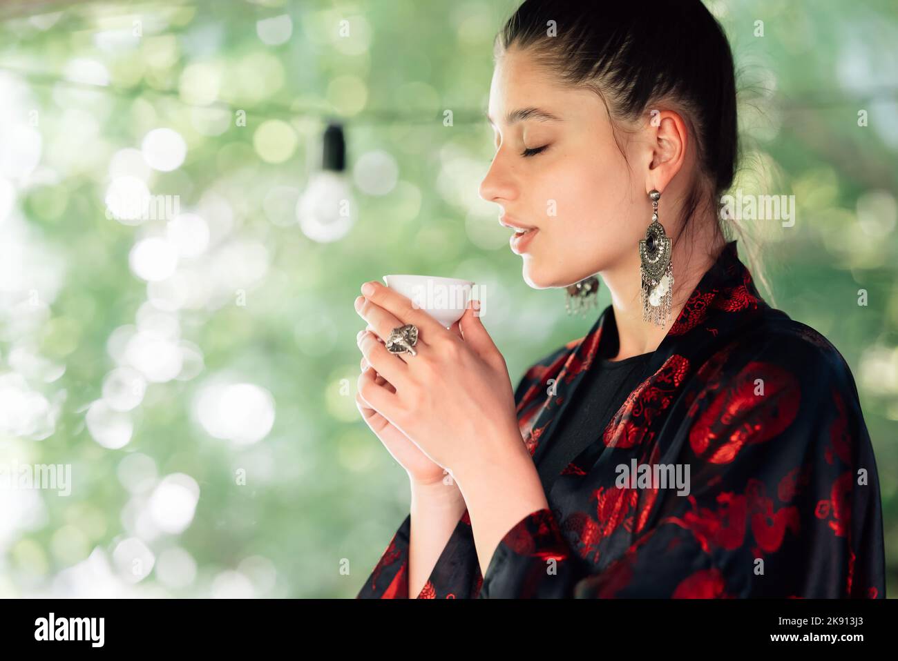 Slow motion woman drinking tea hi-res stock photography and images - Alamy