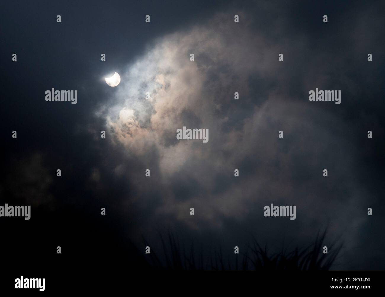 Cairo, Egypt. 25th Oct, 2022. A partial solar eclipse is seen during an ...