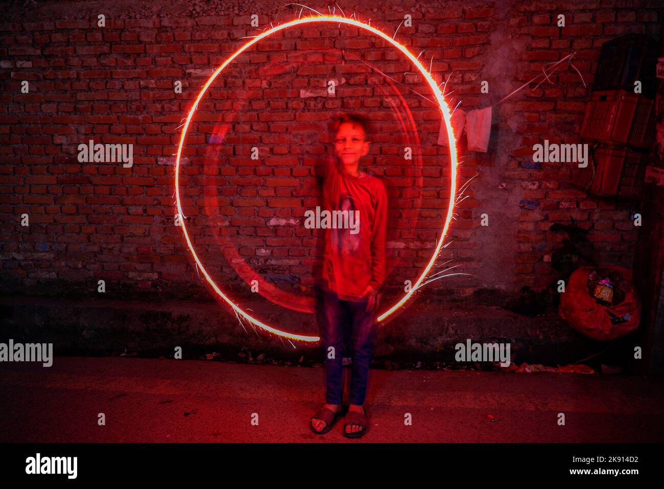 Kathmandu, Nepal. 25th Oct, 2022. A boy lights a firework during the ...