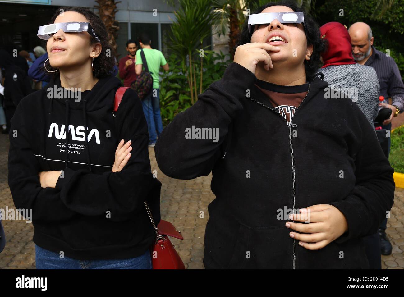 Cairo, Egypt. 25th Oct, 2022. People use glasses to protect their eyes ...