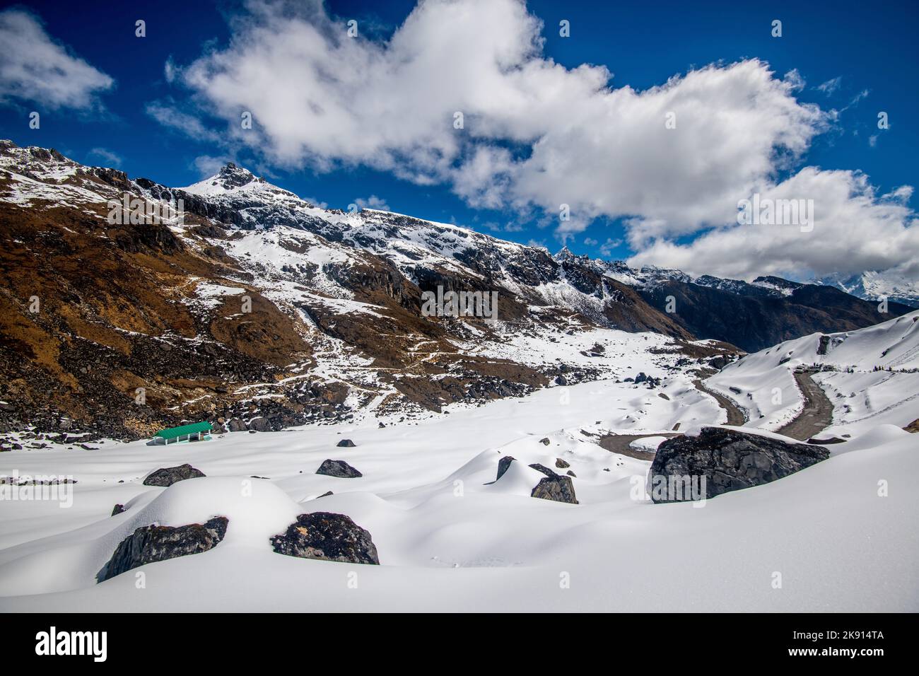 A low-angle of snowy ridged Kala Patthar, Sikkim, India, sunlit, clear ...