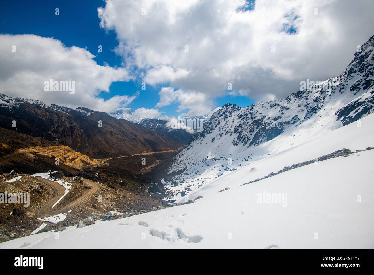 A high-angle of snowy ridged Kala Patthar, Sikkim, India, sunlit ...