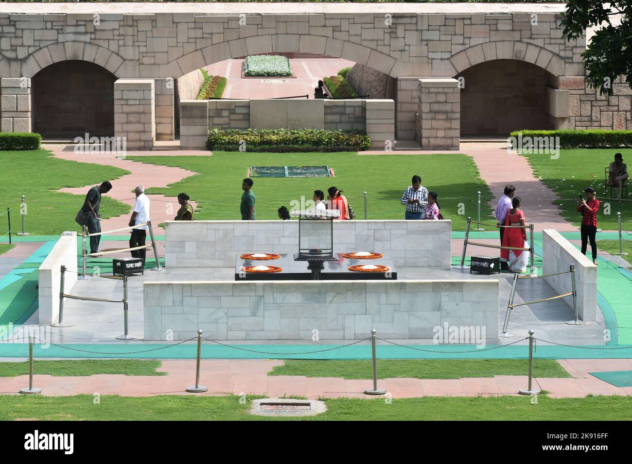 People standing next to the Memorial dedicated to Mahatma Gandhi in Raj ...