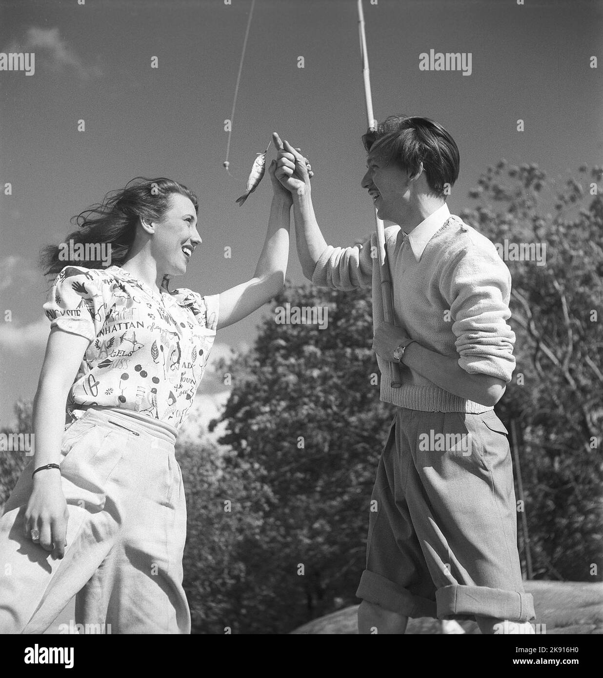 Fishing pole in rod Black and White Stock Photos & Images - Alamy