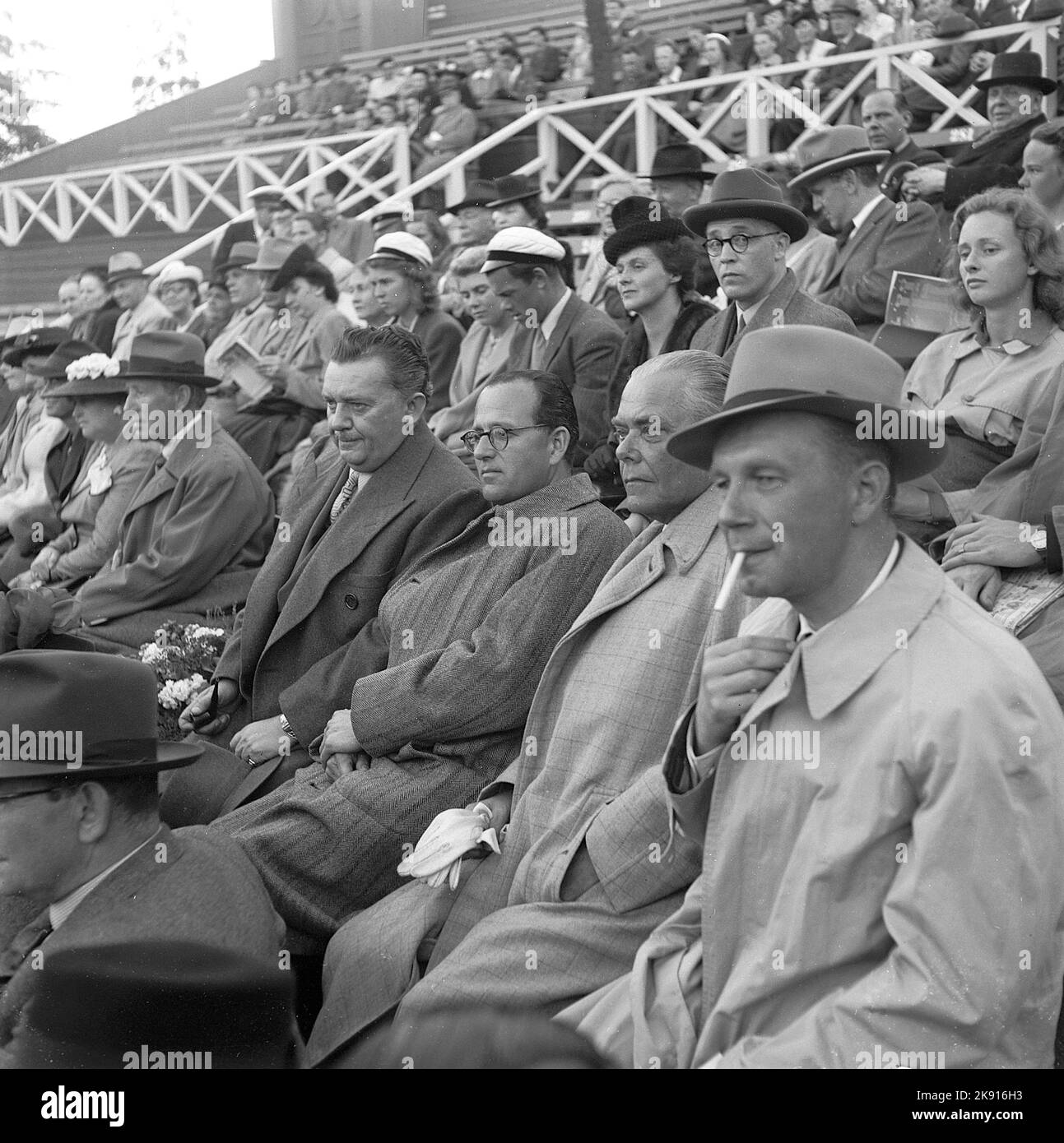 In the 1940s. People are watching something from a stand. Sweden 1945 ...