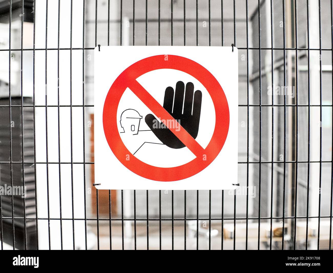 A stop sign of a construction site on a metallic stand Stock Photo - Alamy