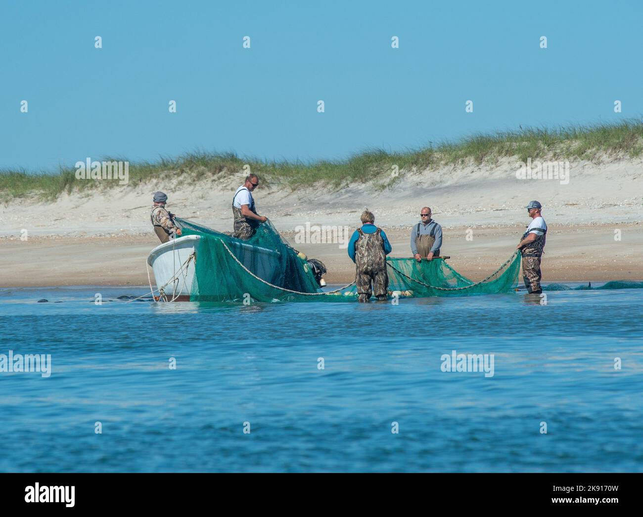 The long haul net crew pulling the nets back on the boat at the end of ...