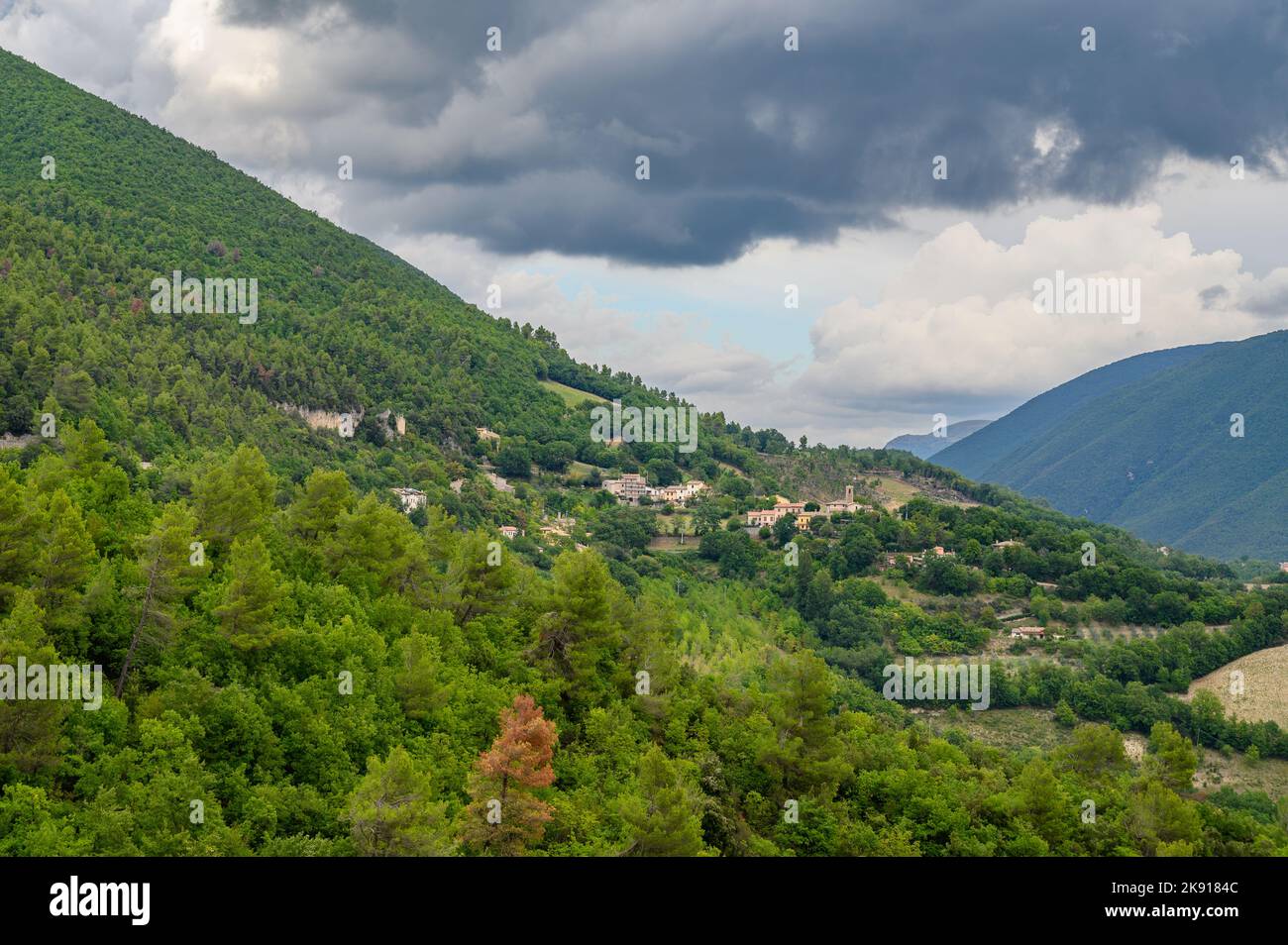 A hamlet sitting on the hillside in the mountainous landscape east of ...