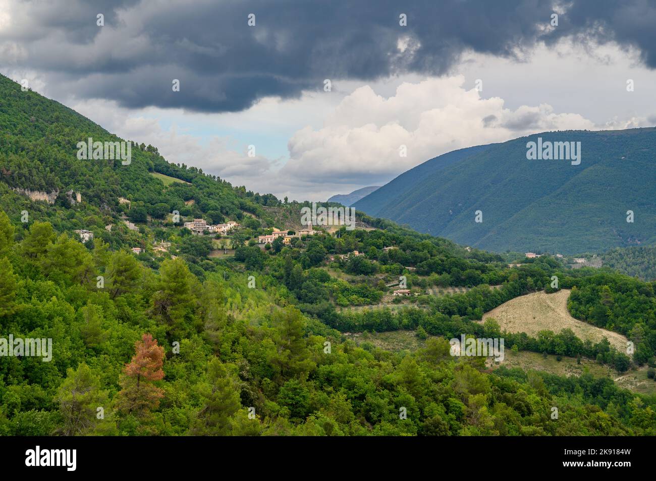 A hamlet sitting on the hillside in the mountainous landscape east of ...