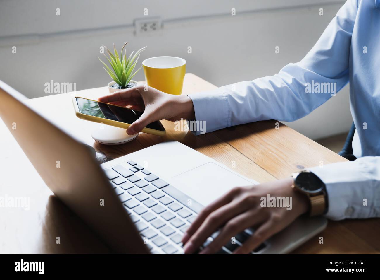 focus Female hand holding Smartphone to Charging at Wireless fast ...