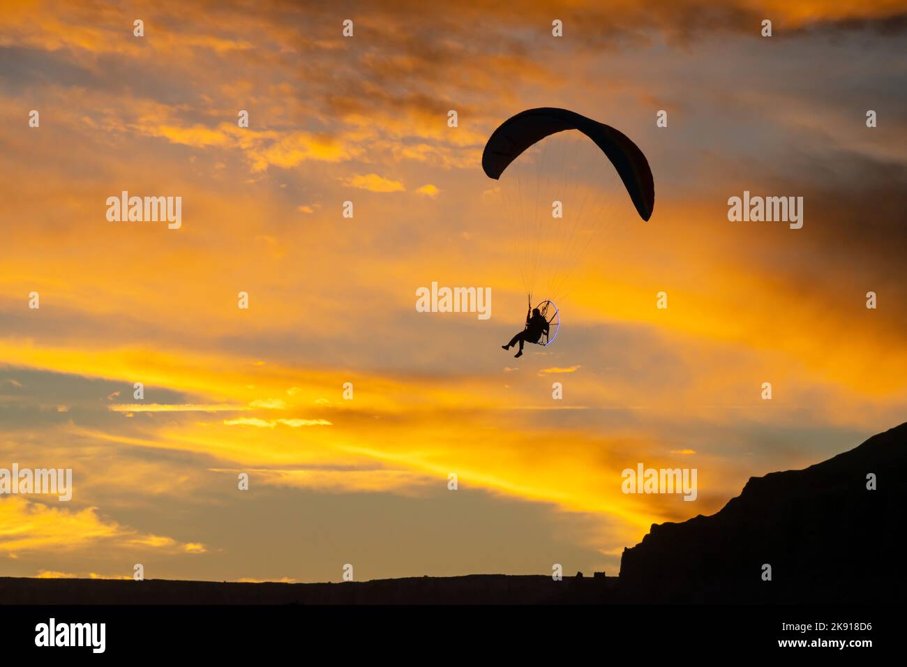 A powered paraglider flying at sunset near Hanksville, Utah Stock Photo - Alamy