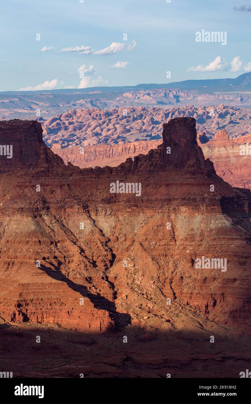 A Wingate sandstone tower in front of the rugged Behind the Rocks area ...