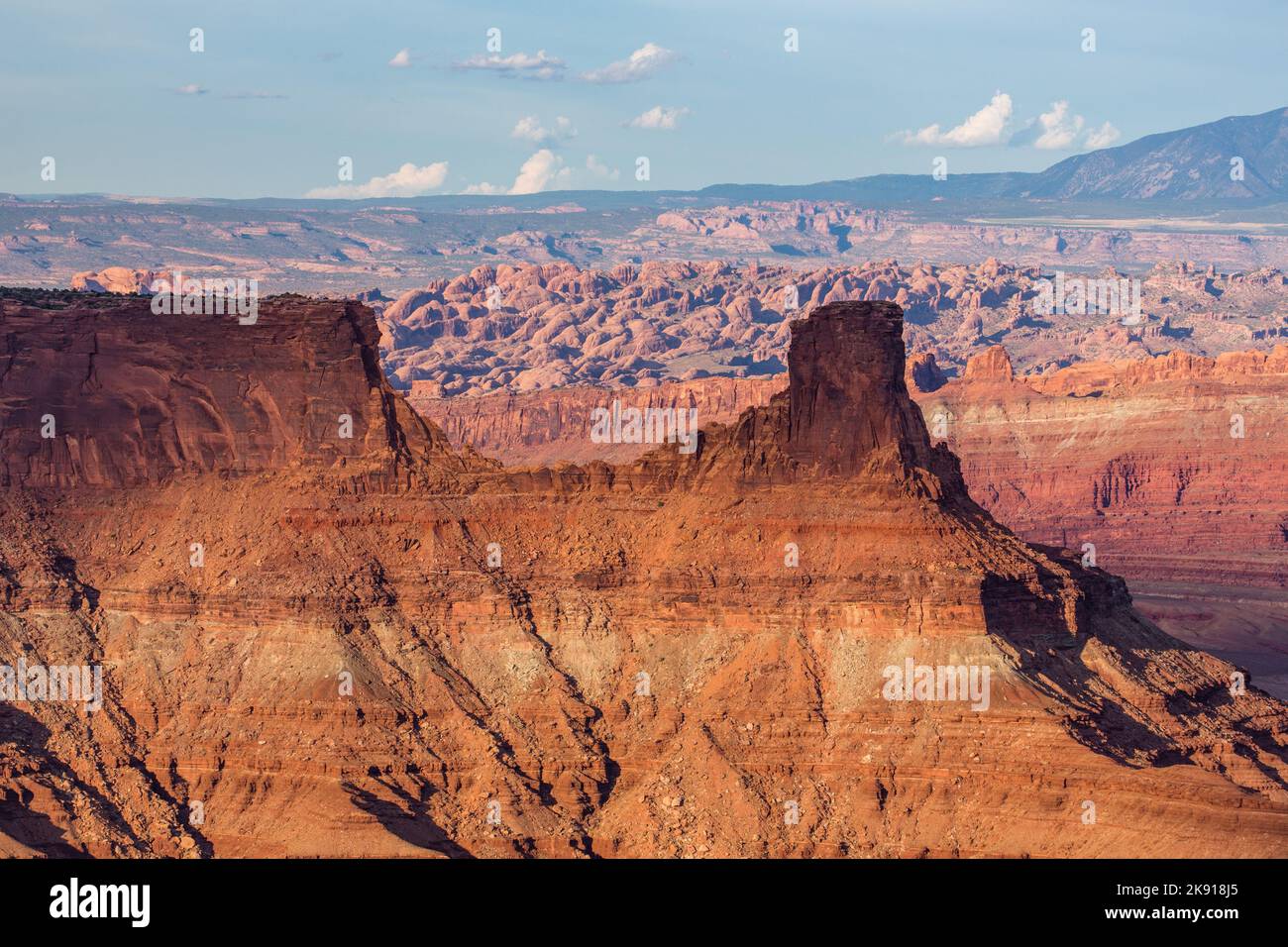 A Wingate sandstone tower in front of the rugged Behind the Rocks area ...