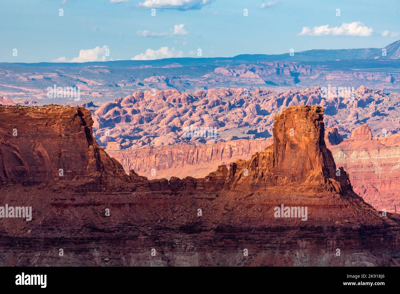 A Wingate sandstone tower in front of the rugged Behind the Rocks area ...