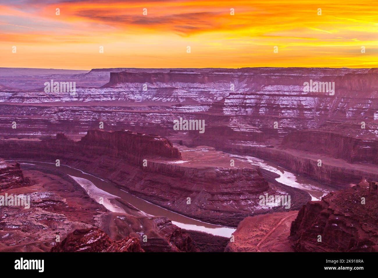 A colorful winter sunset over the Goose Neck of the Colorado River from ...