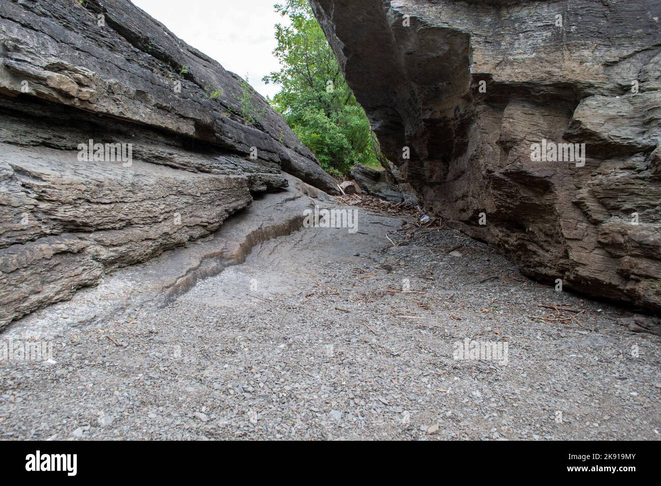 A small sandy pathway with big rocks Stock Photo - Alamy