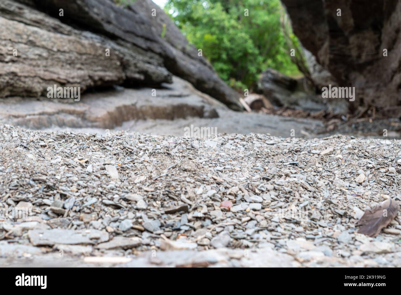 A small sandy pathway with big rocks Stock Photo - Alamy