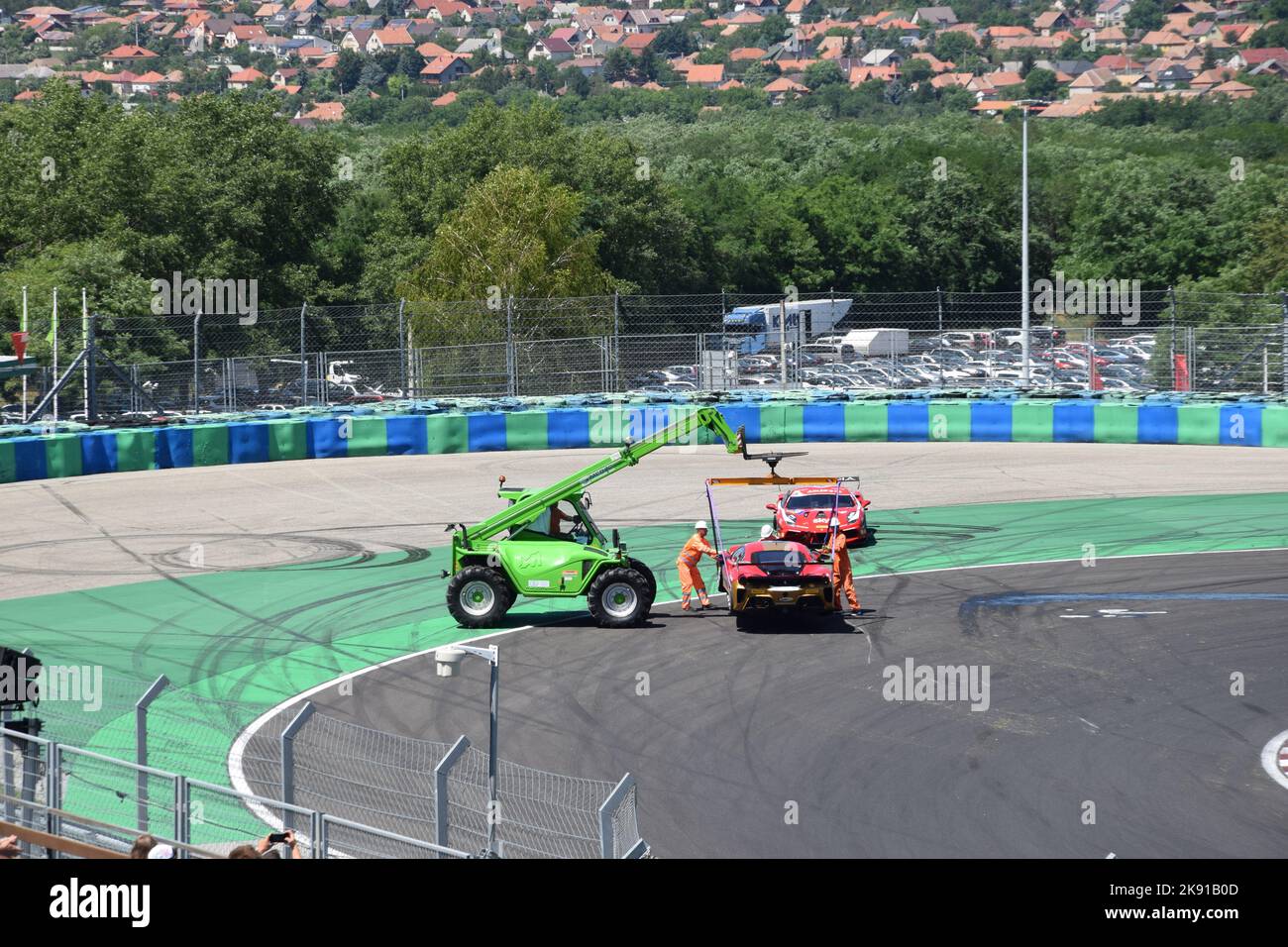 The racing track of Ferrari Challenge in Europe with red wrecked sports ...