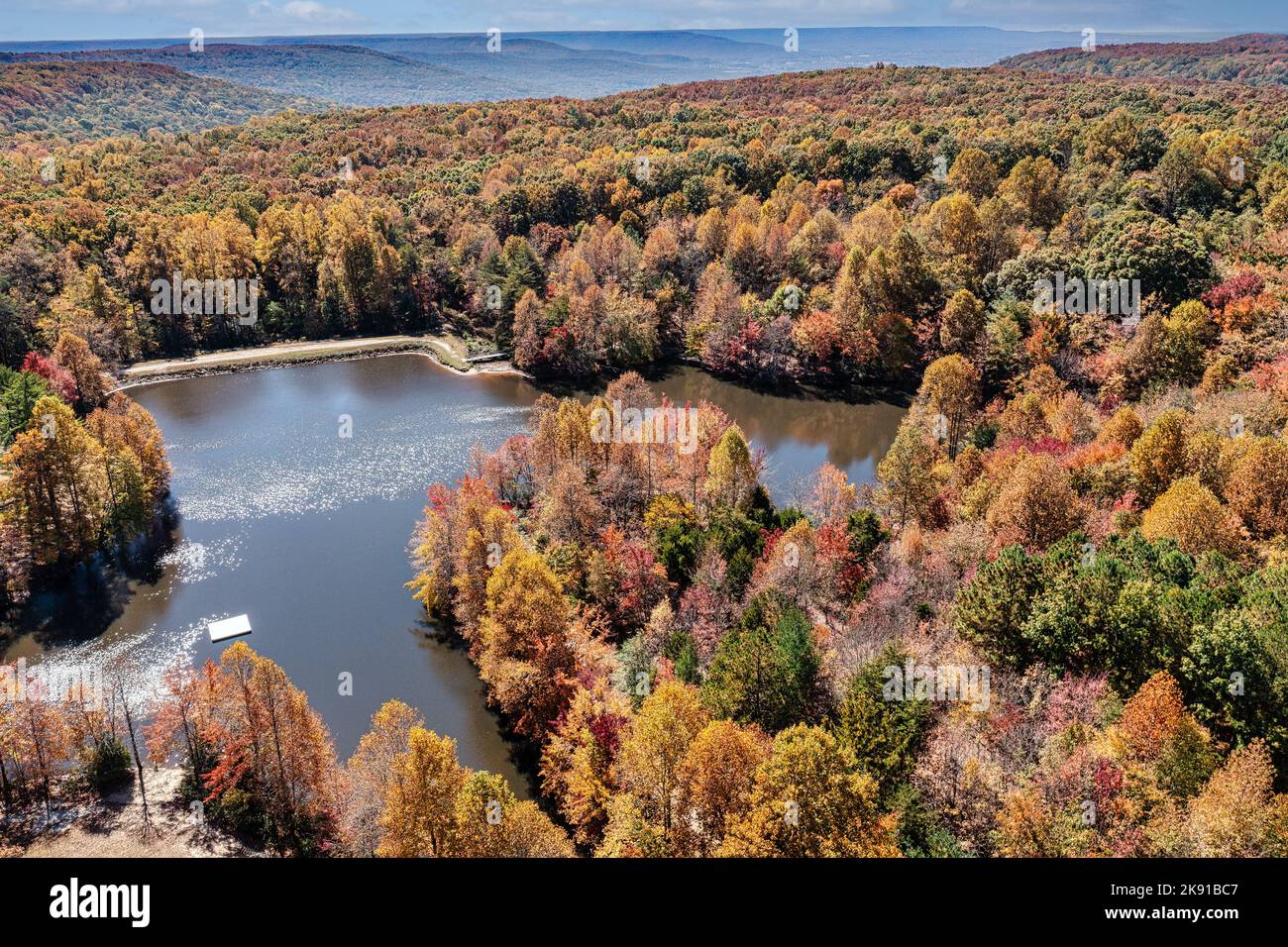 Beautiful mountain top lake on a sunny autumn day with colorful fall ...