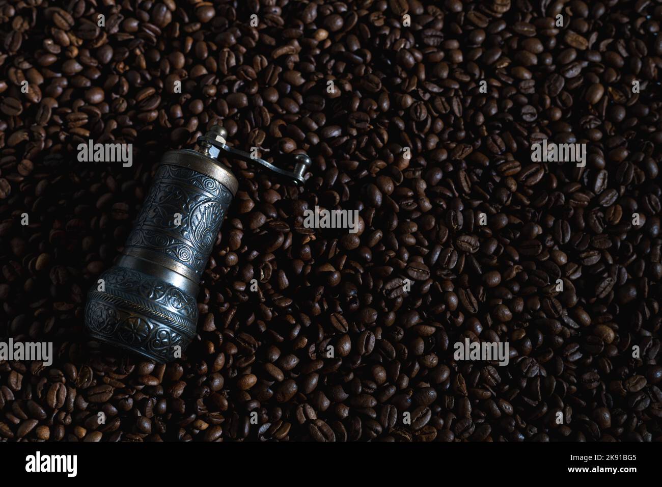 Manual vintage coffee grinder on a background of coffee beans Stock ...