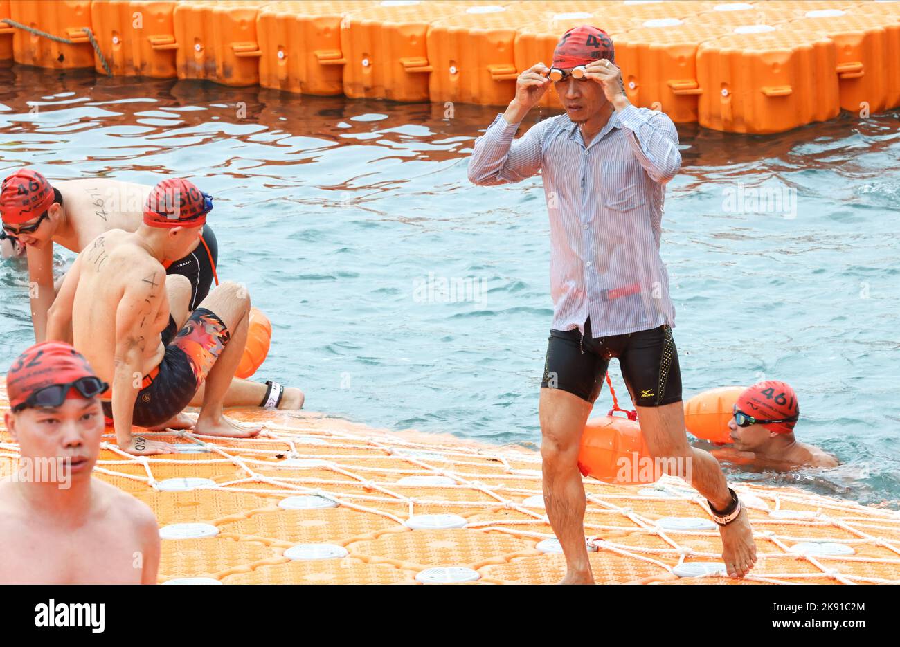 1500 swimmers making waves during New World Harbour Race starting from ...