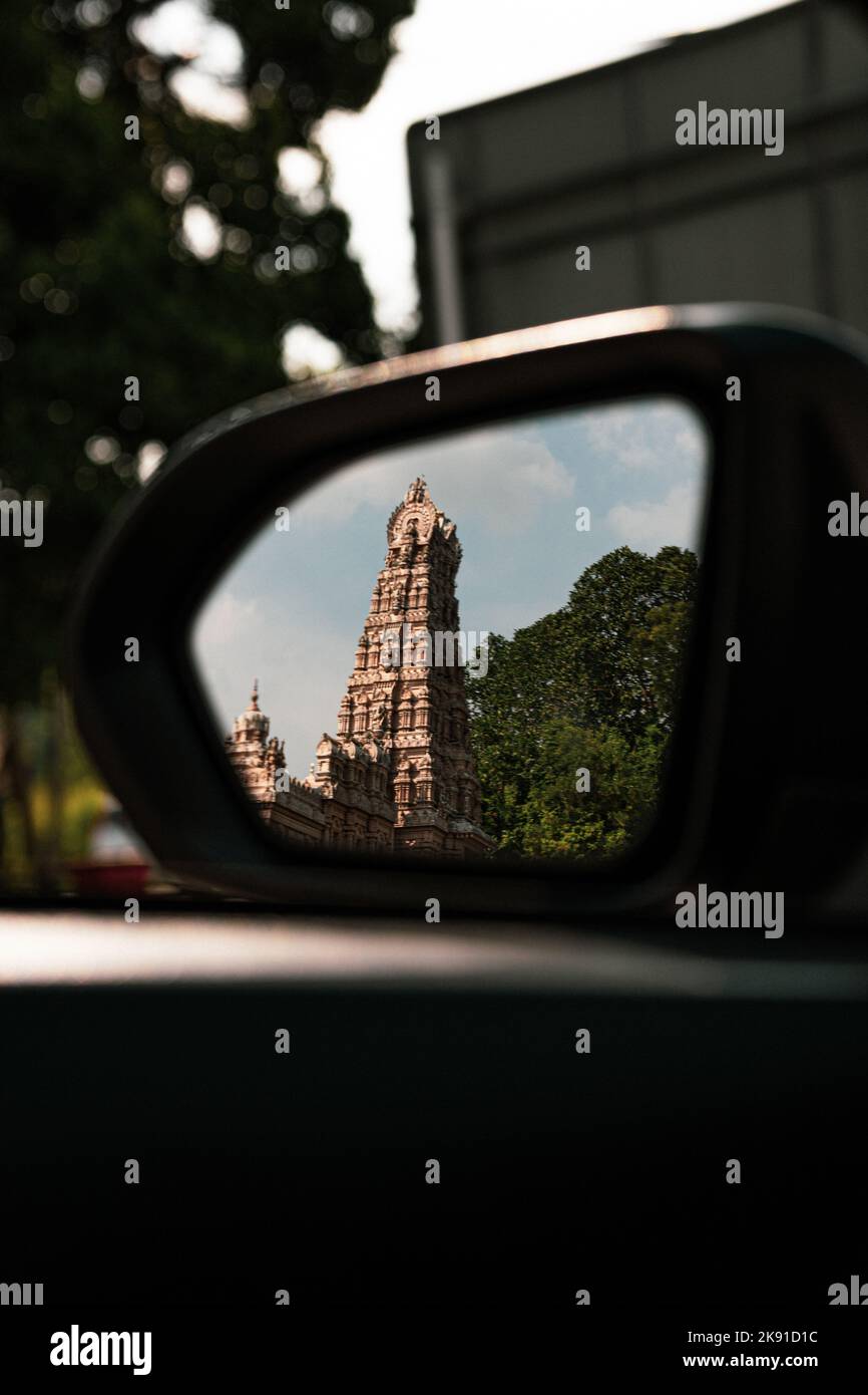 A reflection of Sri Shakti Temple in side-view mirror Stock Photo - Alamy