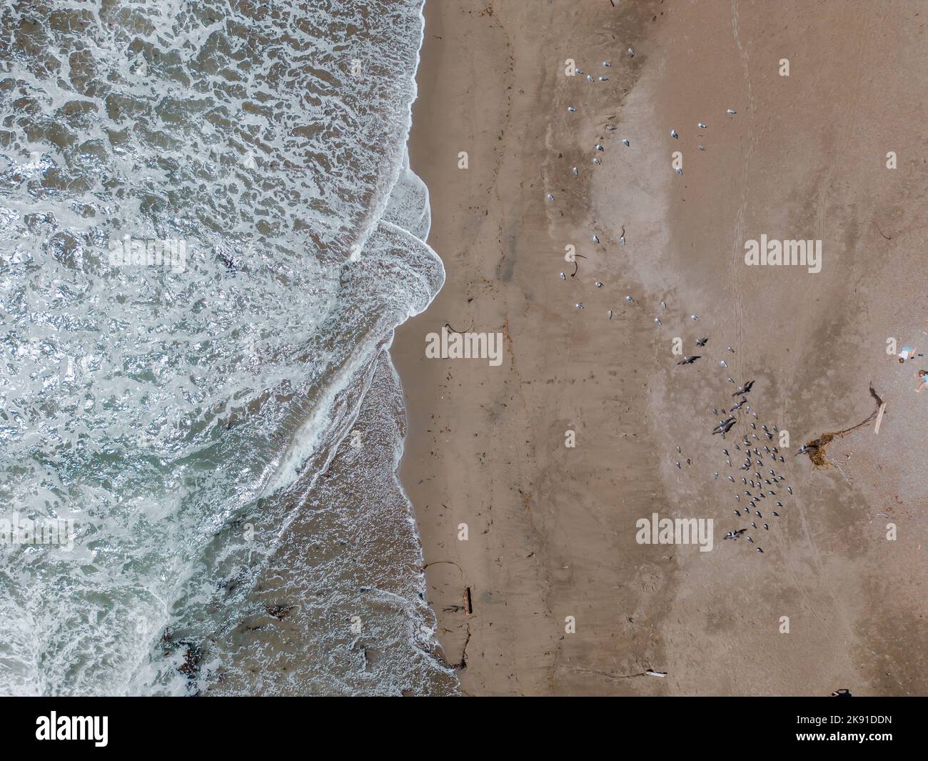 an aerial view of blue ocean waves on the beach Stock Photo - Alamy