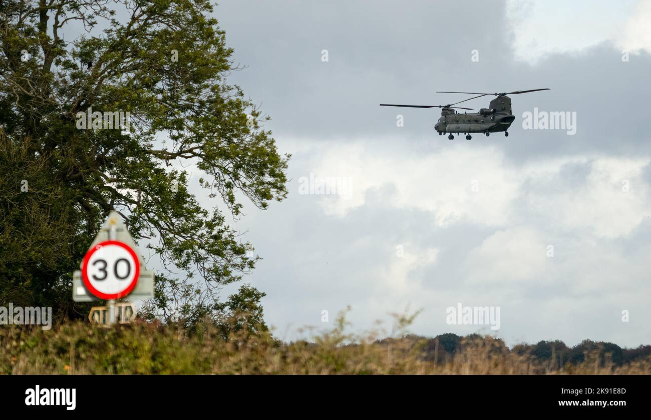 RAF Chinook tandem-rotor CH-47 helicopter flying fast and low in a ...