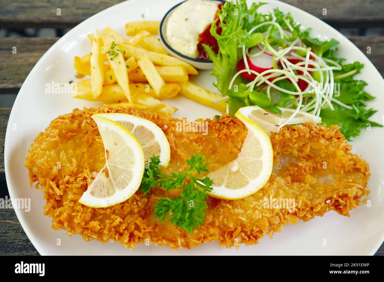 Plate of delectable crunchy fried fish with chips Stock Photo - Alamy