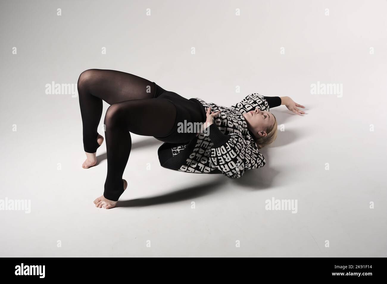 Ballet dancer woman black dress on gray background, Ballerina posing ...