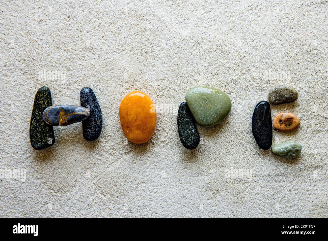 Colored pebbles word hi-res stock photography and images - Alamy