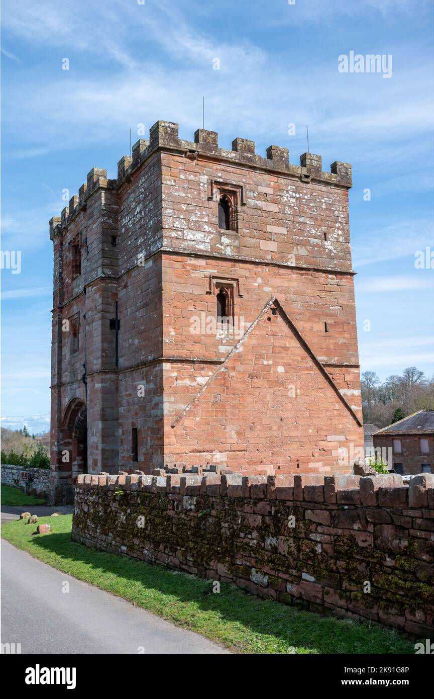 The vertical view of Wetheral Priory Gatehouse building under the blue ...