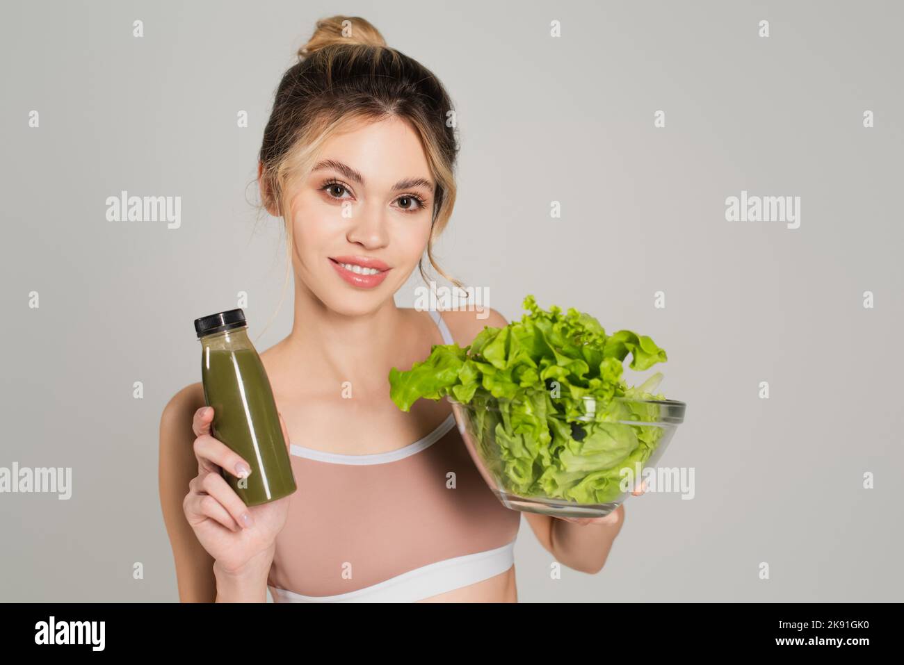 happy woman with perfect skin holding fresh smoothie and bowl of ...
