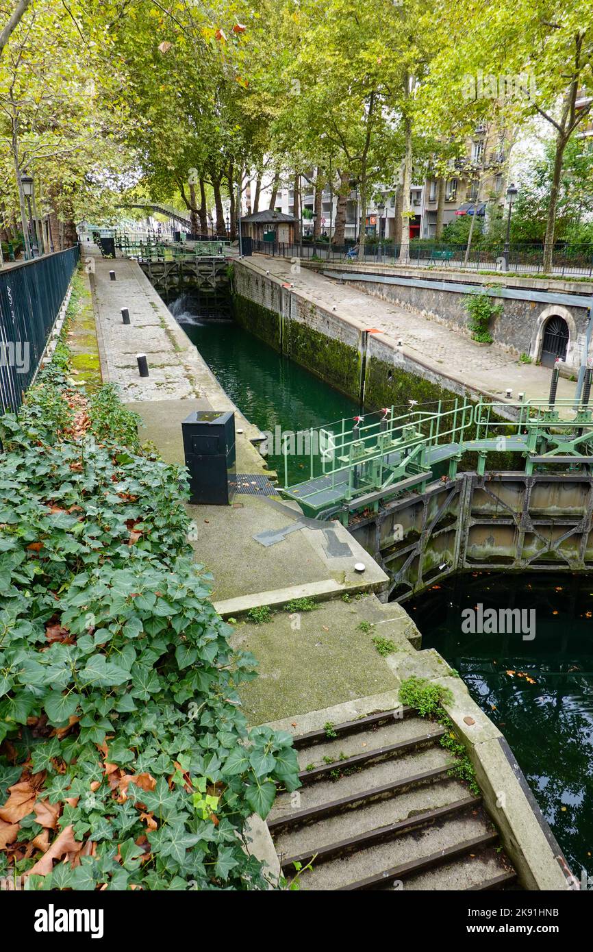 Lock on the Canal Saint-Martin where the canal ducks underground on its ...