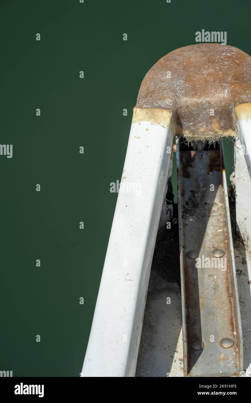 A vertical shot of the tip of a wooden boat on a calm sea Stock Photo ...