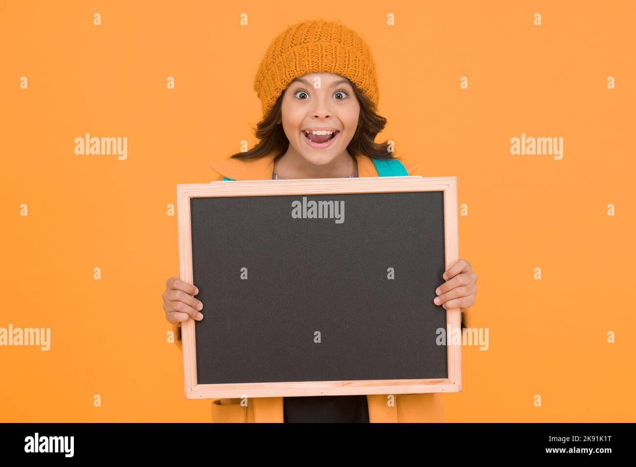 Information education materials. Happy small child hold blank ...