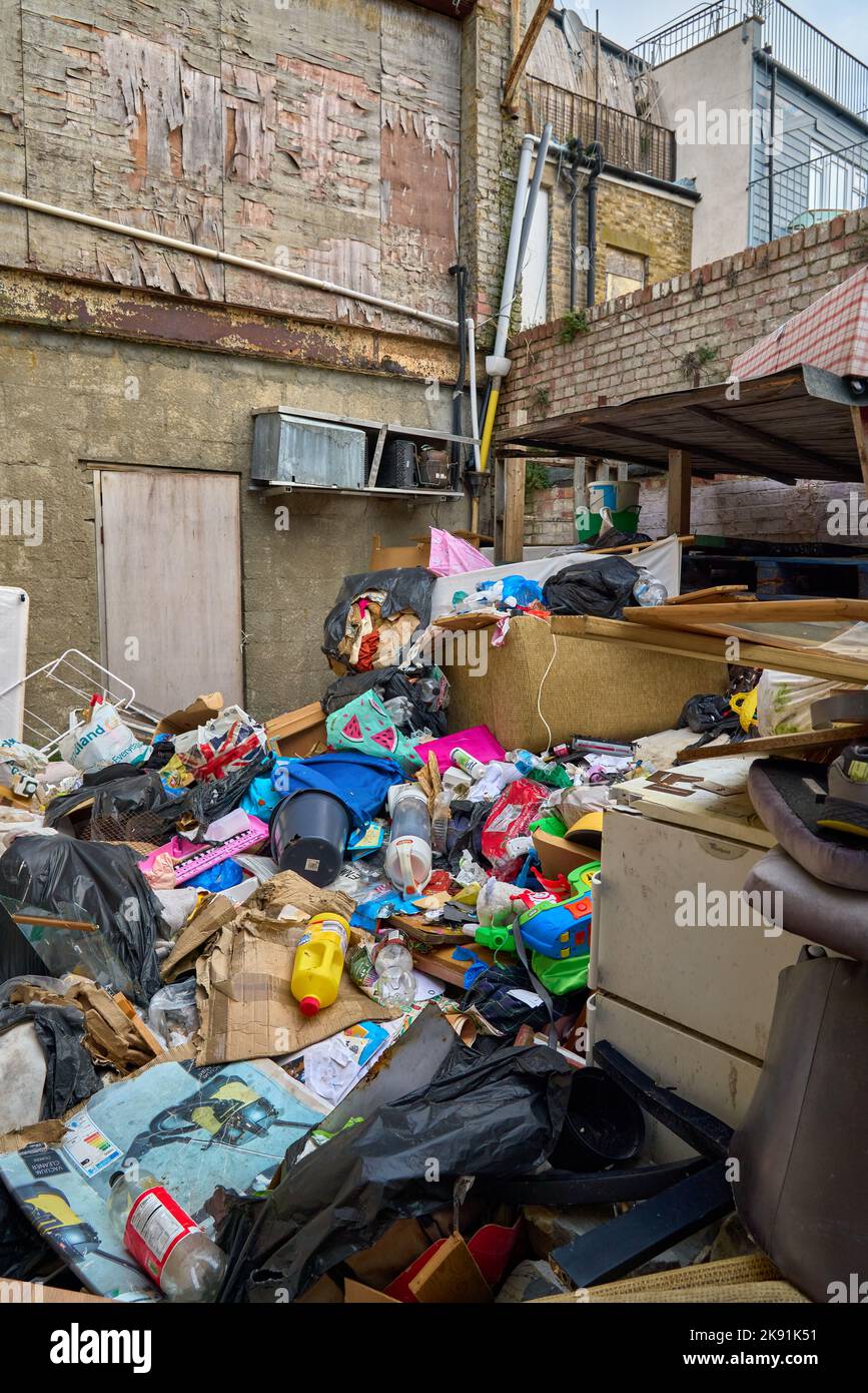 A vertical shot of pile of garbage on a back street in Margate ...