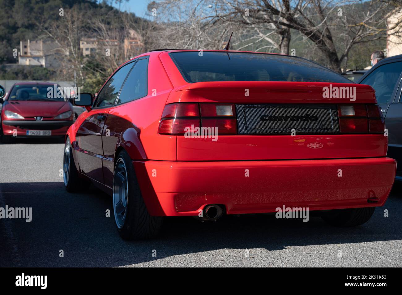 A closeup of a detail of a red Volkswagen Corrado parked on the street ...