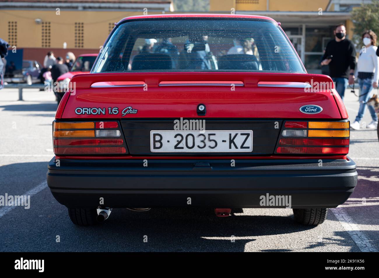 A closeup of a detail of an old red Ford Orion parked on the street ...