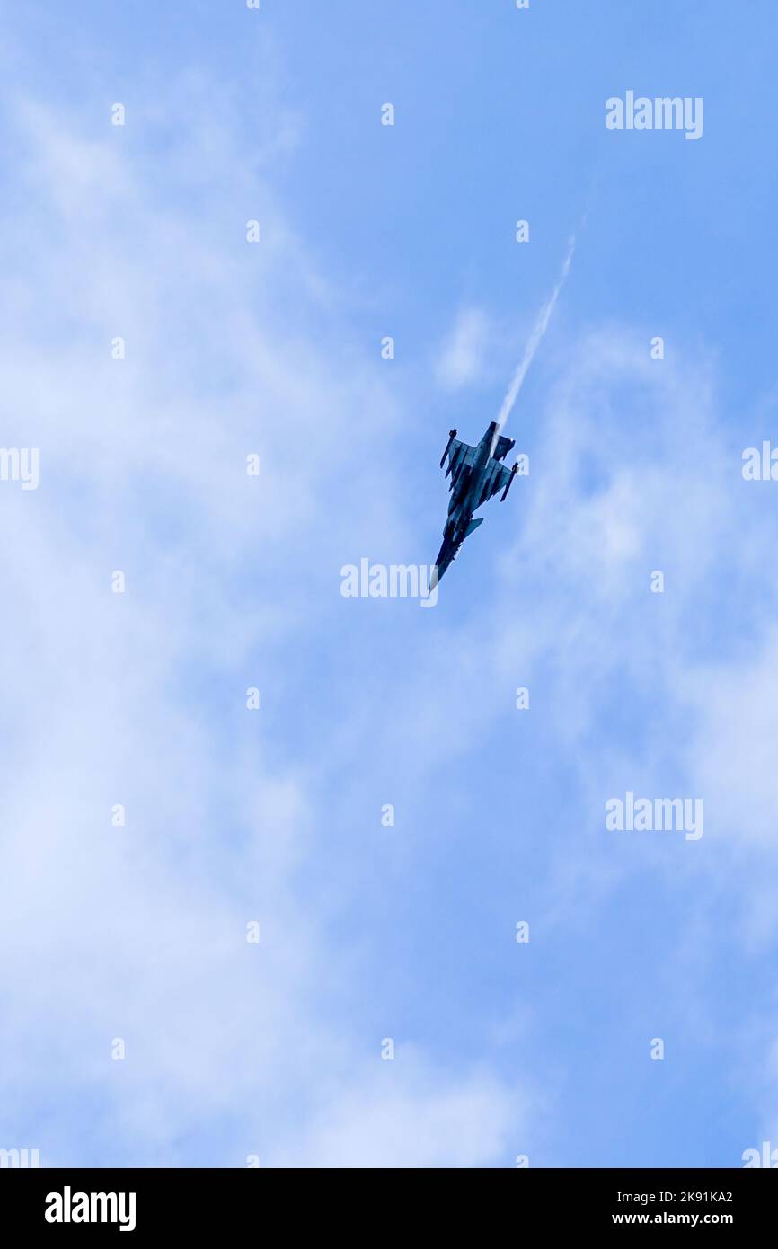 Military supersonic fighter jet performs a maneuvers down diagonally ...