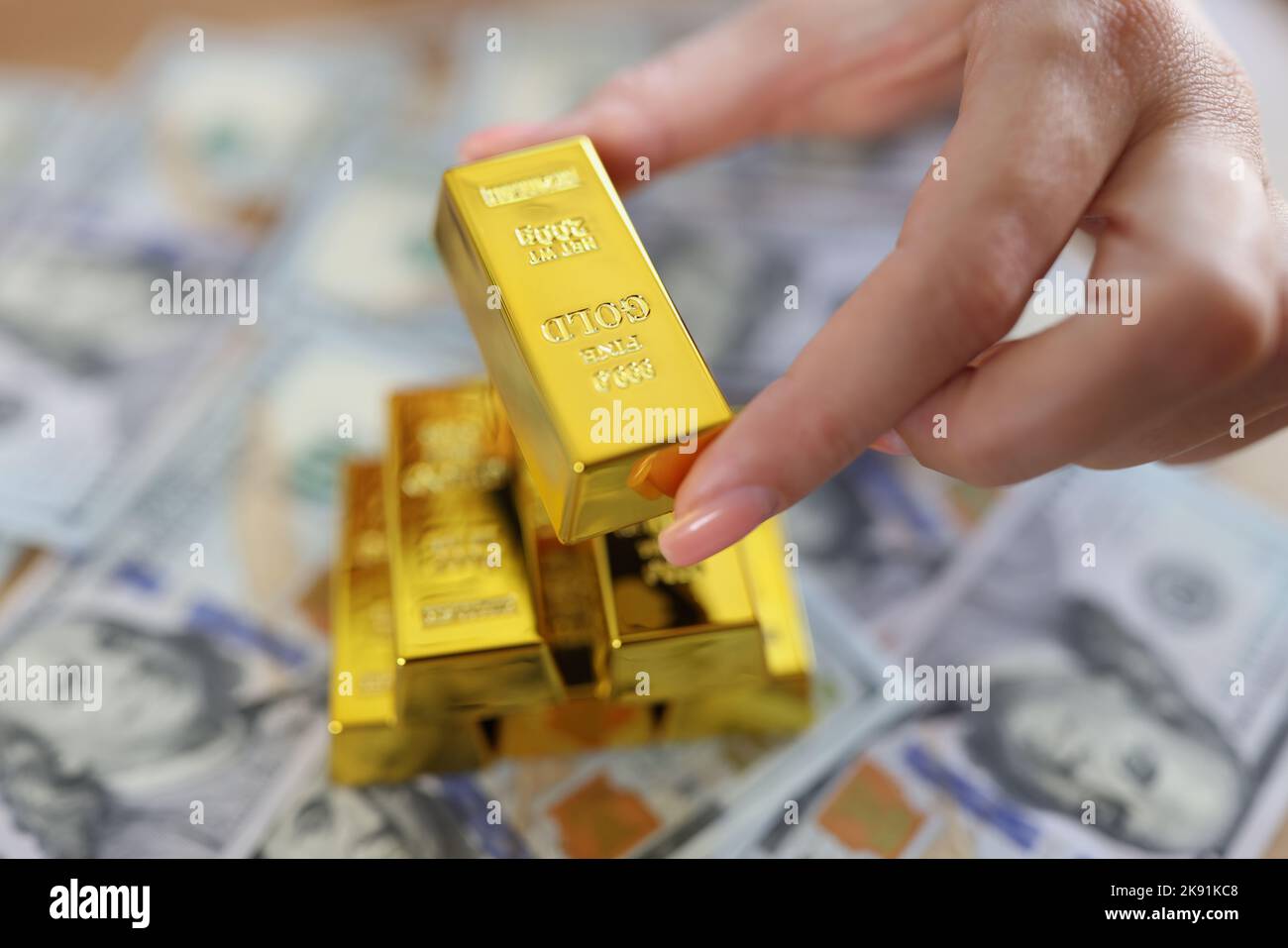 Gold ingots hand hi-res stock photography and images - Alamy